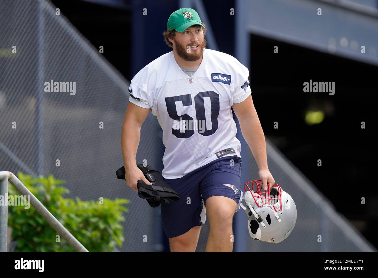 New England Patriots offensive lineman Cole Strange steps on the field ...