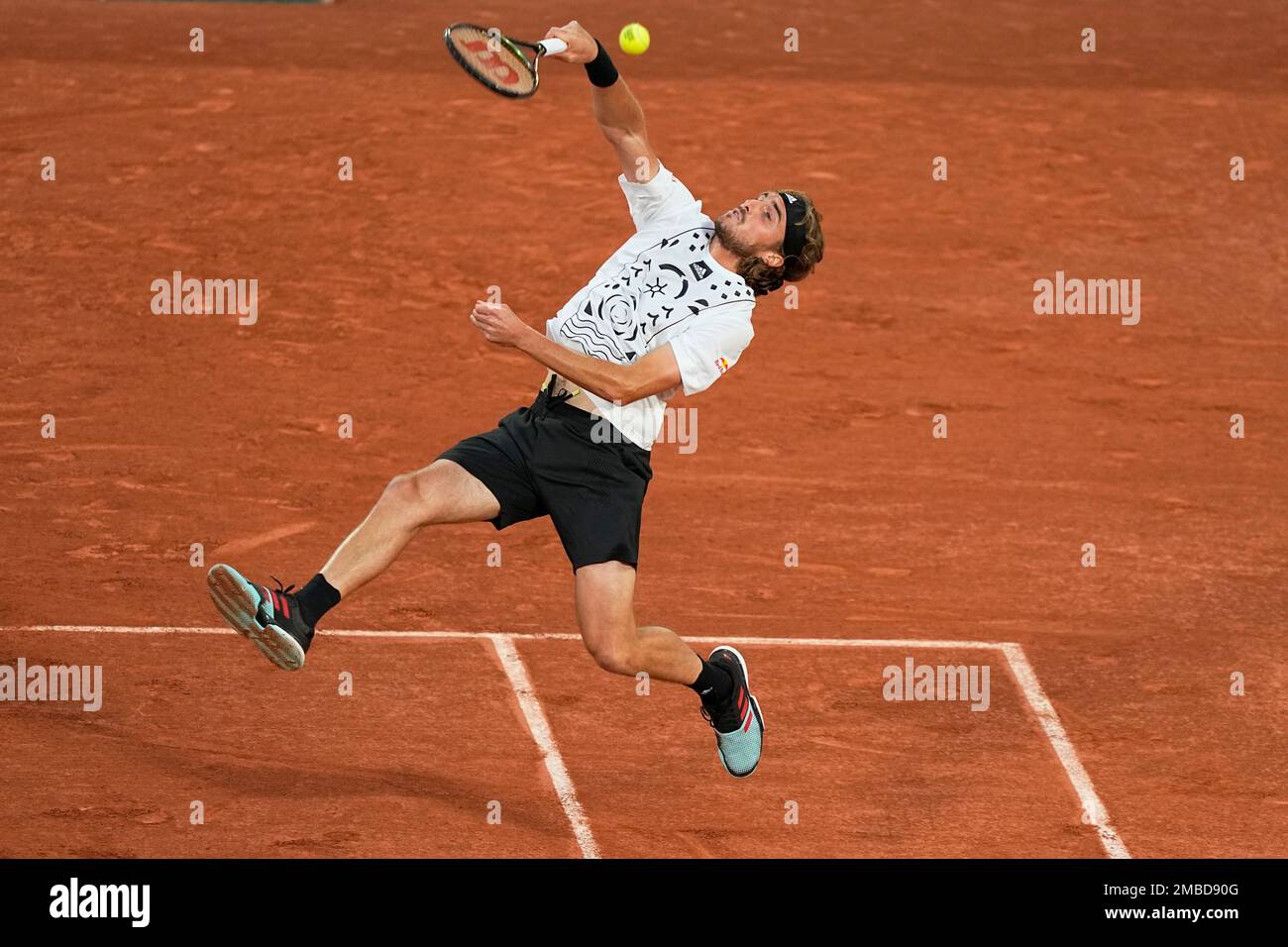 Greece's Stefanos Tsitsipas smashes the ball to Italy's Lorenzo Musetti ...