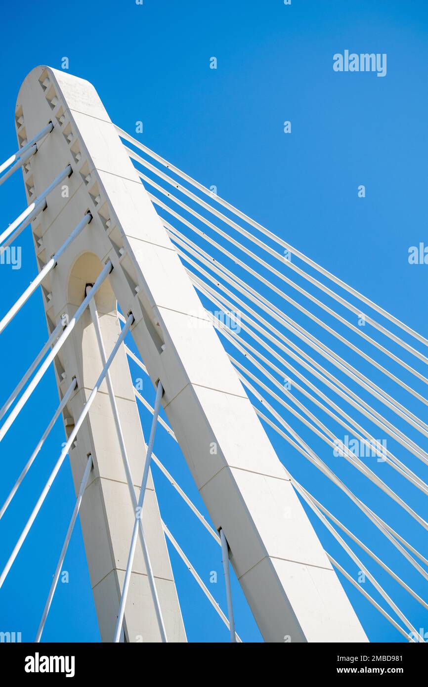 a abstract image of a bridge pillar with support cables against blue ...