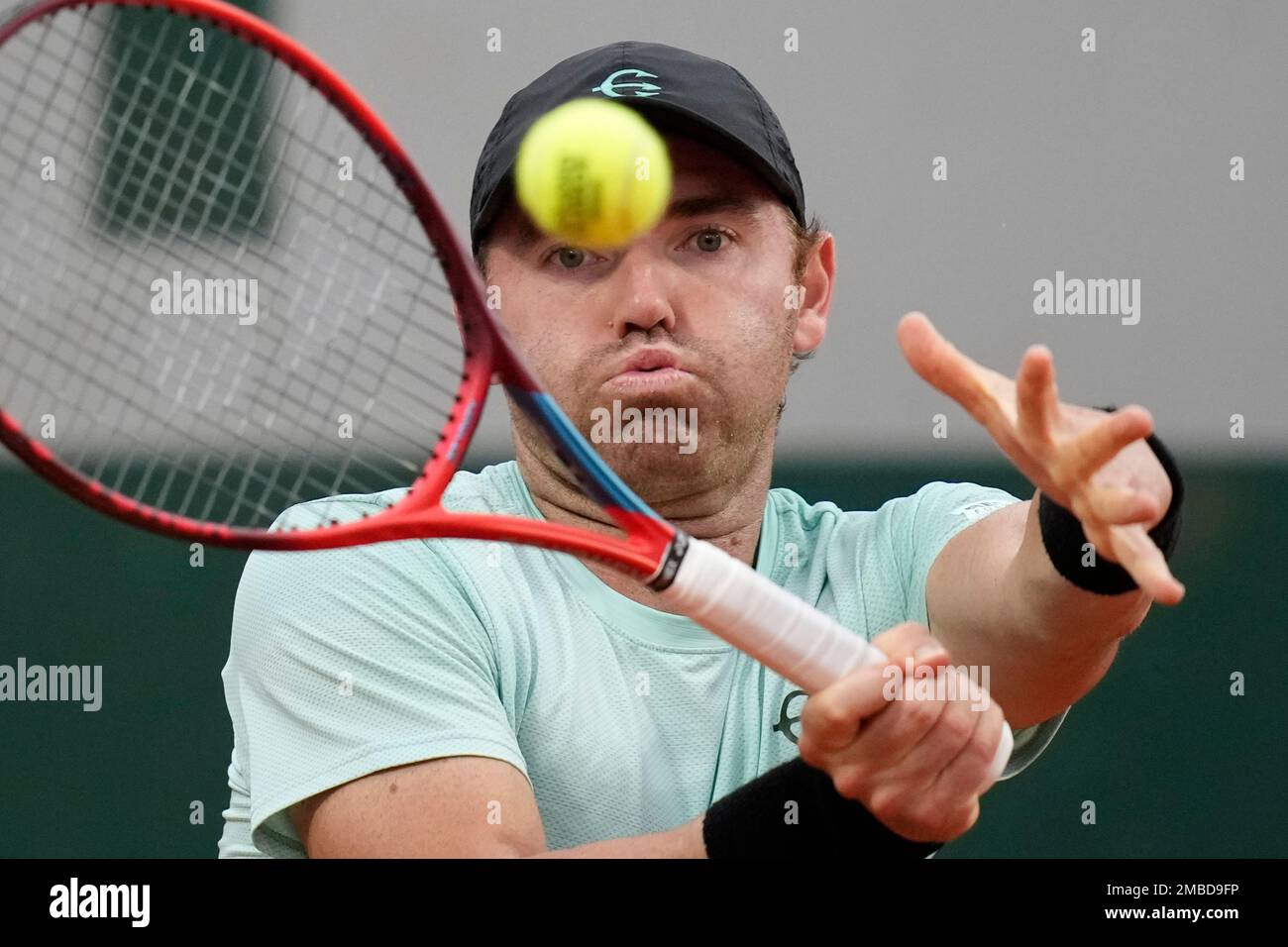 Bjorn Fratangelo of the U.S.returns the ball to Italy's Jannik Sinner ...