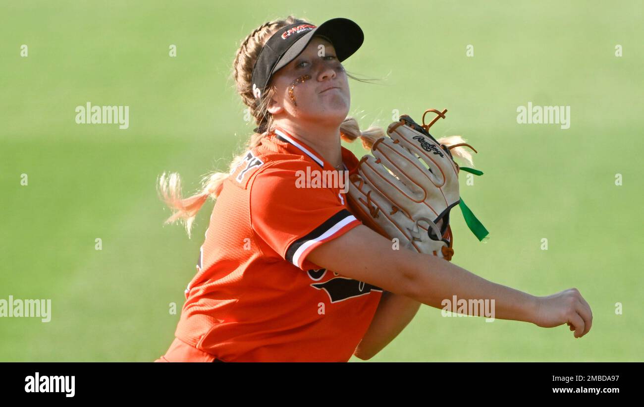 Campbell player Erin Rafferty warms up for an NCAA softball game ...