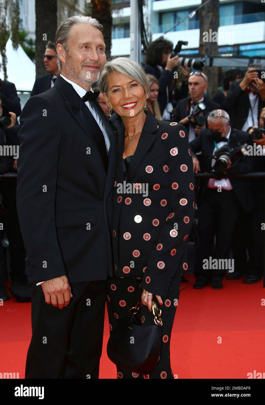 Mads Mikkelsen, left, and Hanne Jacobsen pose for photographers upon ...