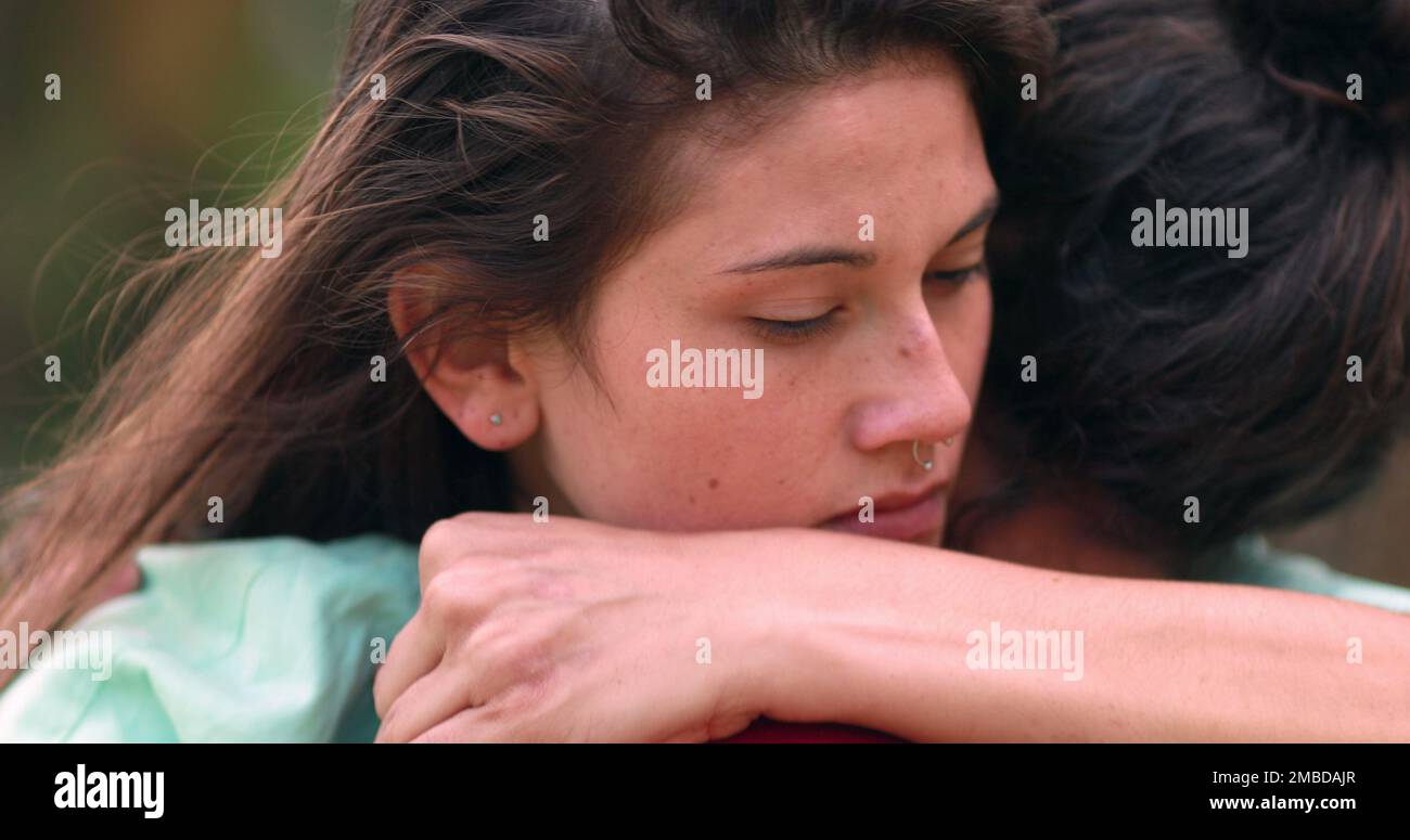 Two women hugging each other. Female friends compassion support embrace ...