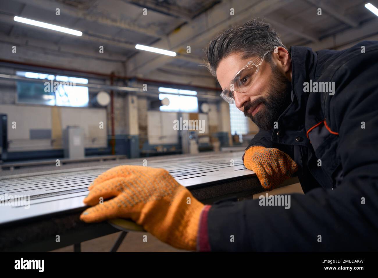 Close up photo of worker cutting with instrument Stock Photo - Alamy