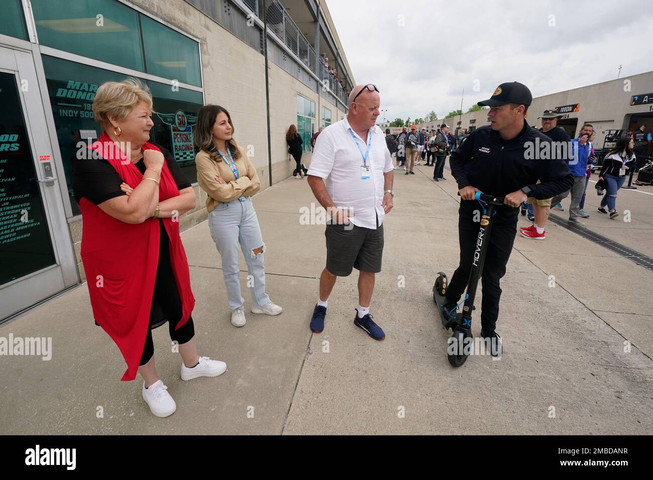 Scott McLaughlin, right, of New Zealand, talks with his parents Wayne ...
