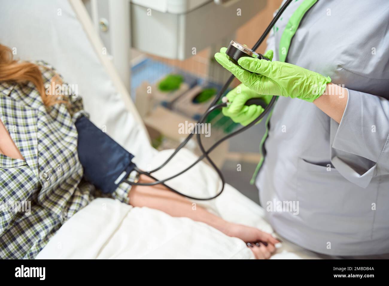 Close up photo of nurse checking woman health Stock Photo - Alamy