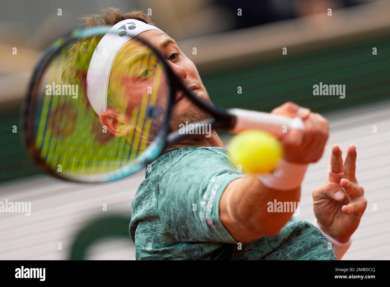 Norway's Casper Ruud plays a shot against France's Jo-Wilfried Tsonga ...