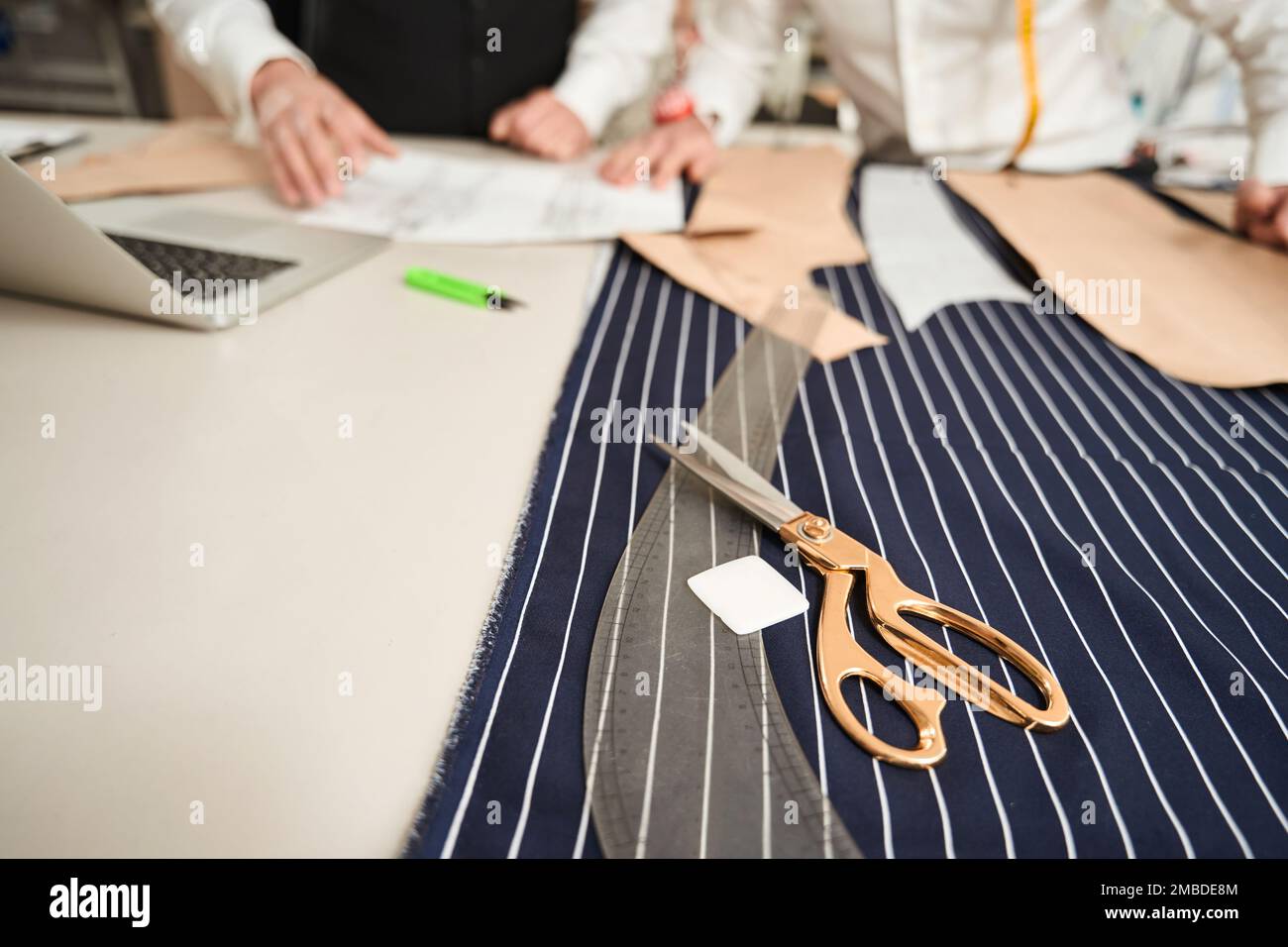 Two professionals working on new clothing collection Stock Photo - Alamy