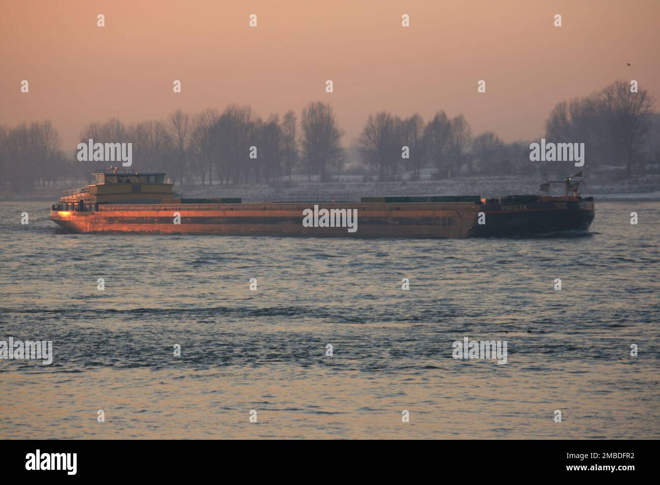 a vessel on a german river in the sunset Stock Photo - Alamy