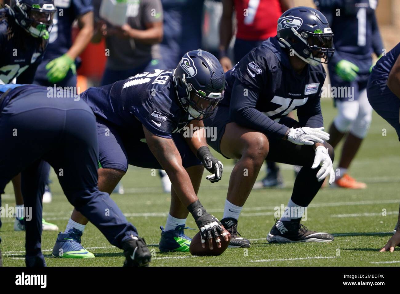 Seattle Seahawks center Kyle Fuller, center, and tackle Greg Eiland ...