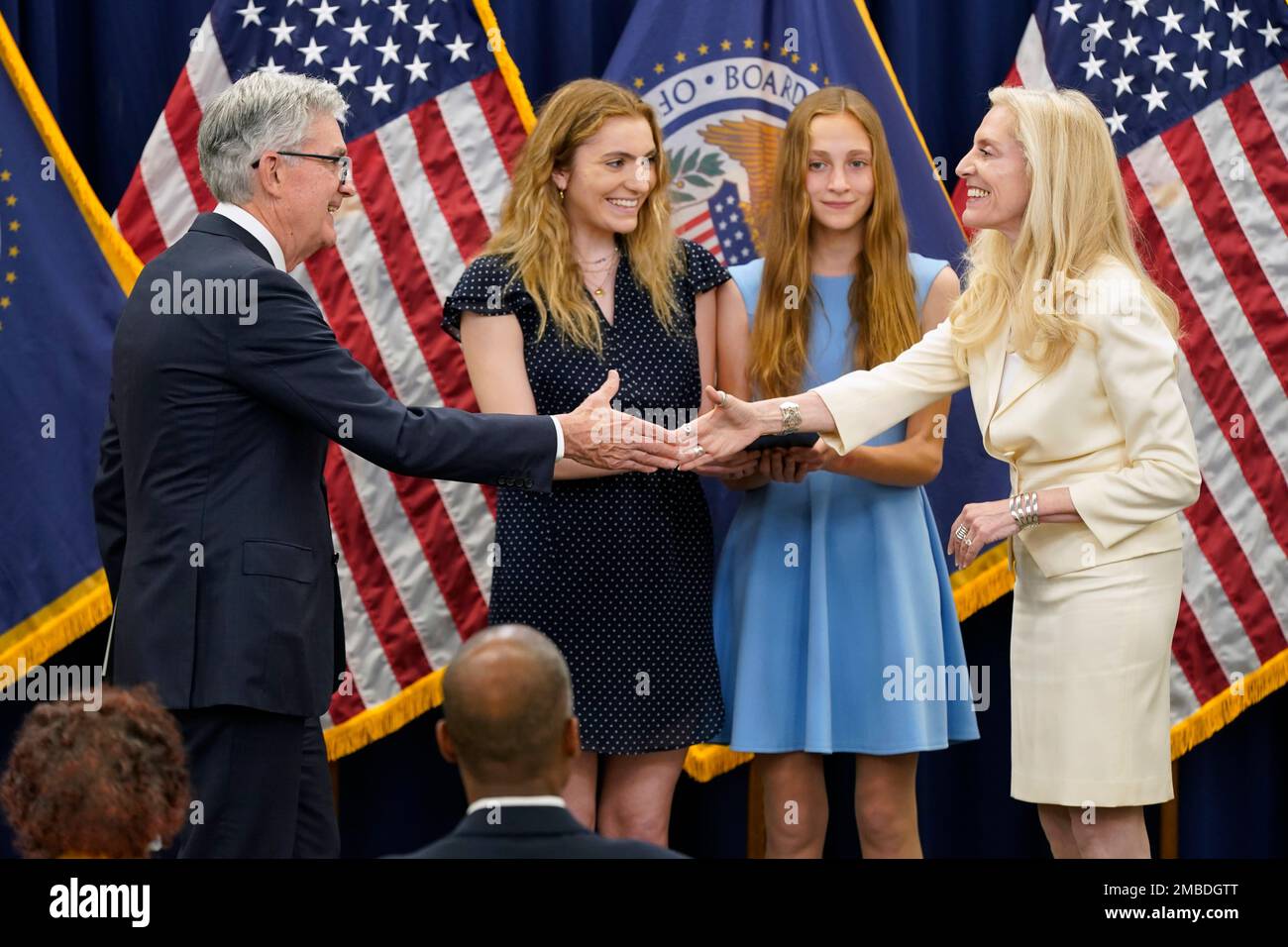 Federal Reserve Board Vice Chair Lael Brainard, right, shakes hands ...