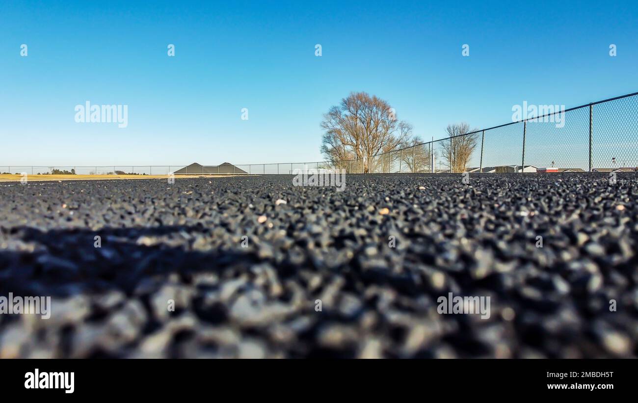 Ground level photo of a rubberized track surface Stock Photo - Alamy