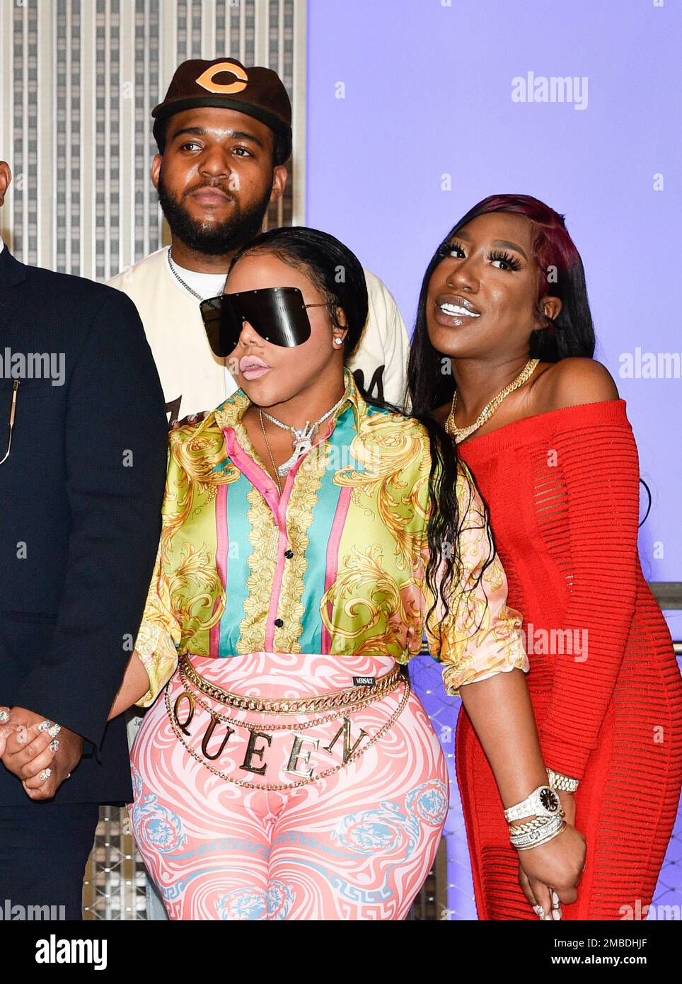 CJ Wallace, Lil' Kim and T'yanna Wallace, right, participate in an Empire State Building ...