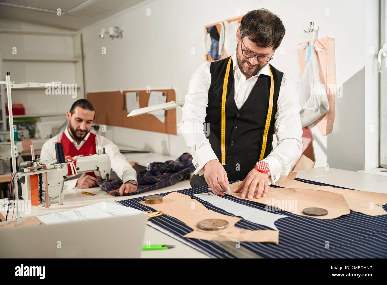 Smiling tailor in atelier hi-res stock photography and images - Alamy