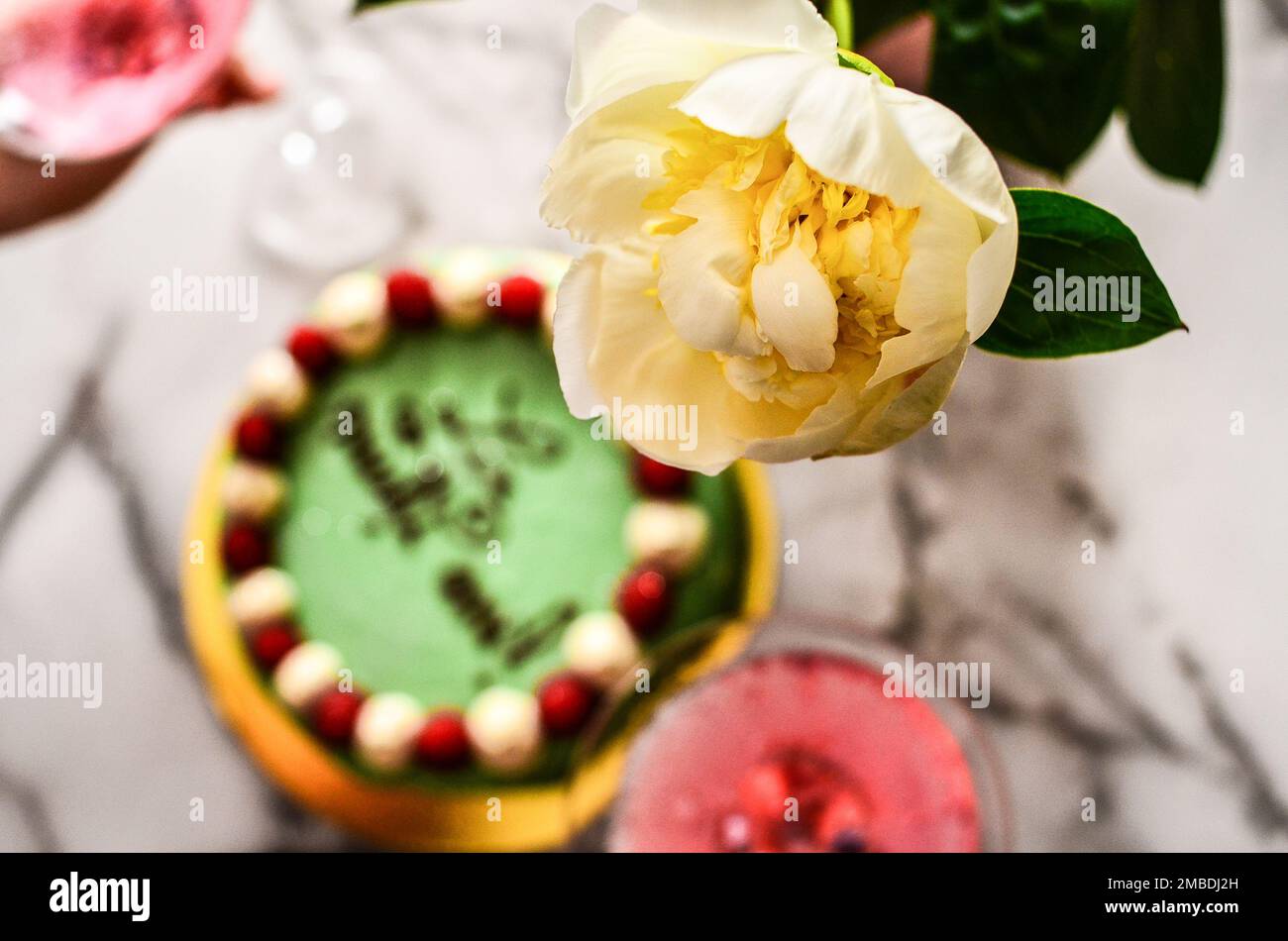 birthday cake made of pistachio, raspberry and vanilla cream, yellow ...
