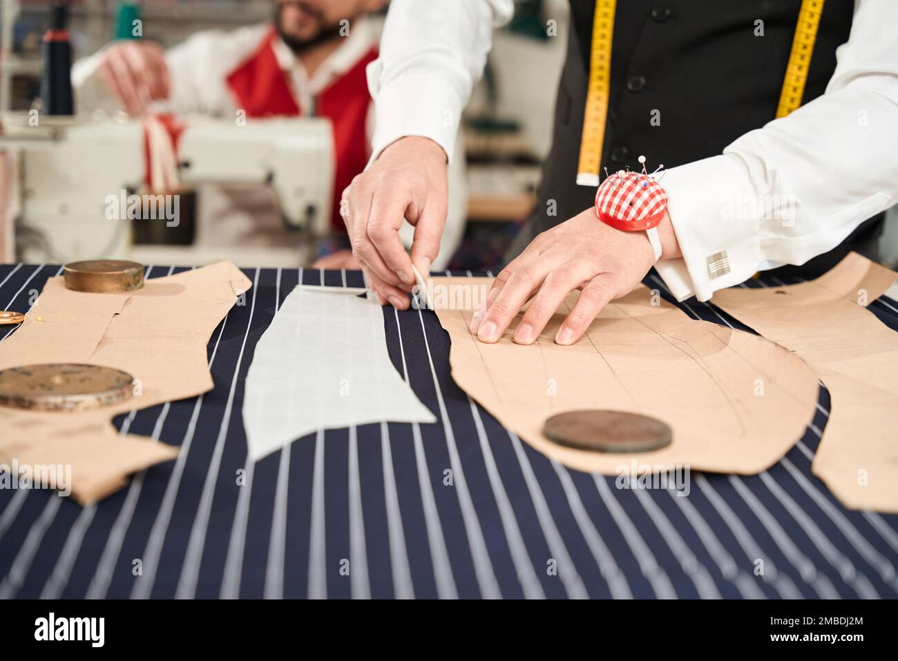 Professional tailor and his colleague in atelier Stock Photo - Alamy