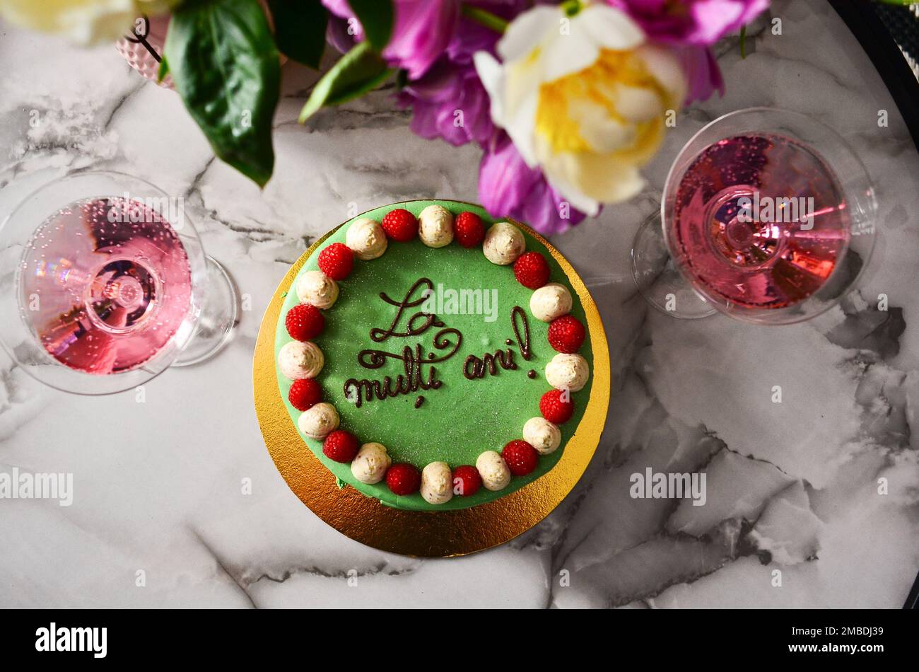 birthday cake made of pistachio, raspberry and vanilla cream, yellow ...