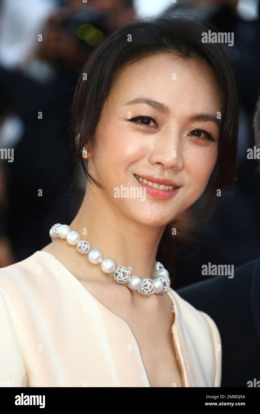 Tang Wei poses for photographers upon arrival at the premiere of the ...