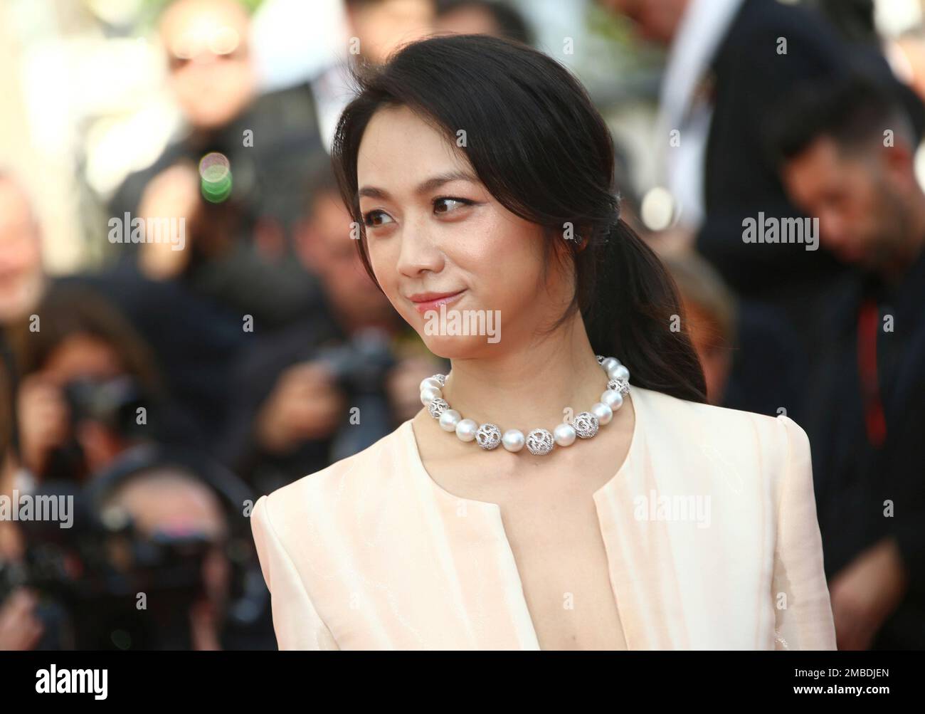 Tang Wei poses for photographers upon arrival at the premiere of the ...
