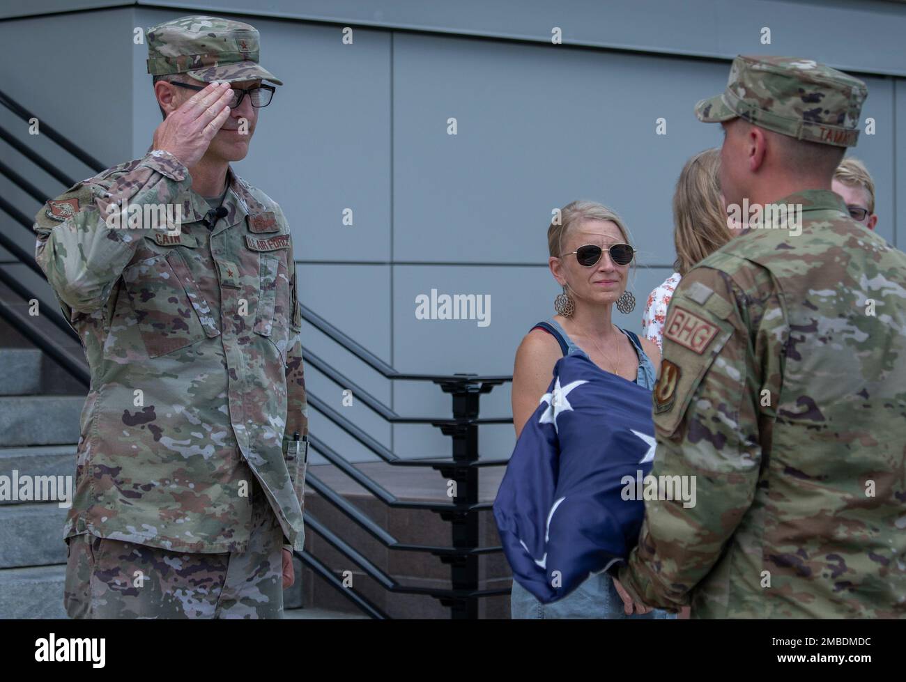 Brig. Gen. Scott Cain, 96th TW commander, salutes as the flag is ...