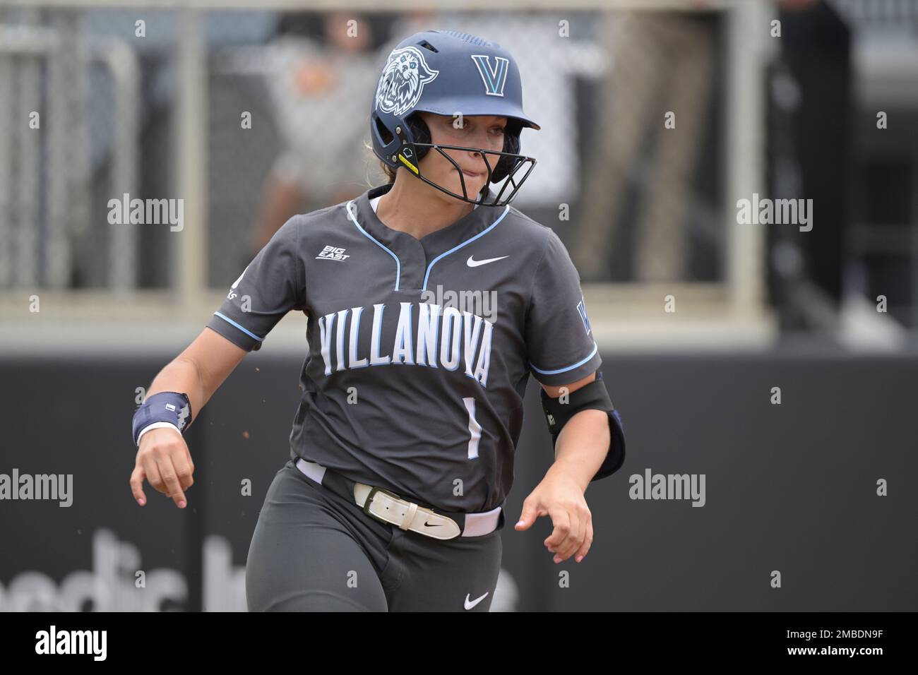 Villanova's Angela Giampolo (1) runs after hitting a pitch during an ...