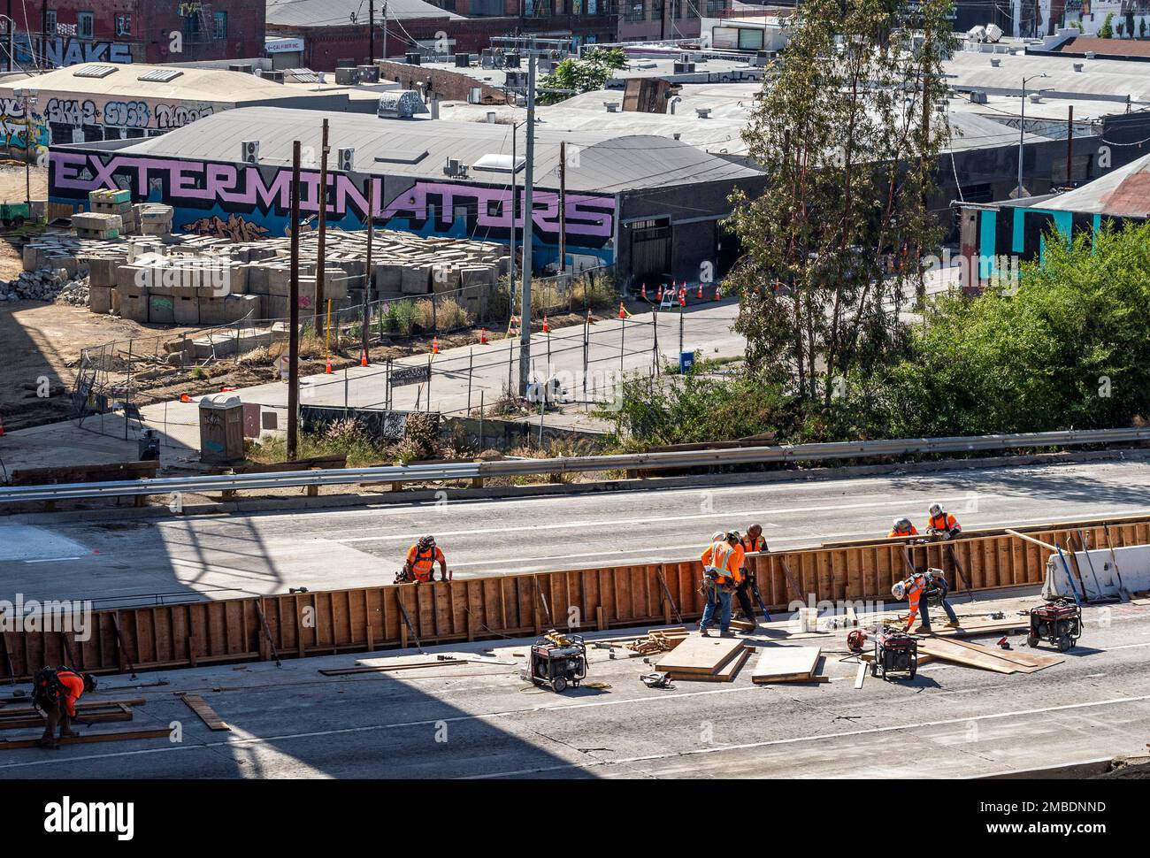 Workers built a median wall for the closed CA-101 freeway under the ...