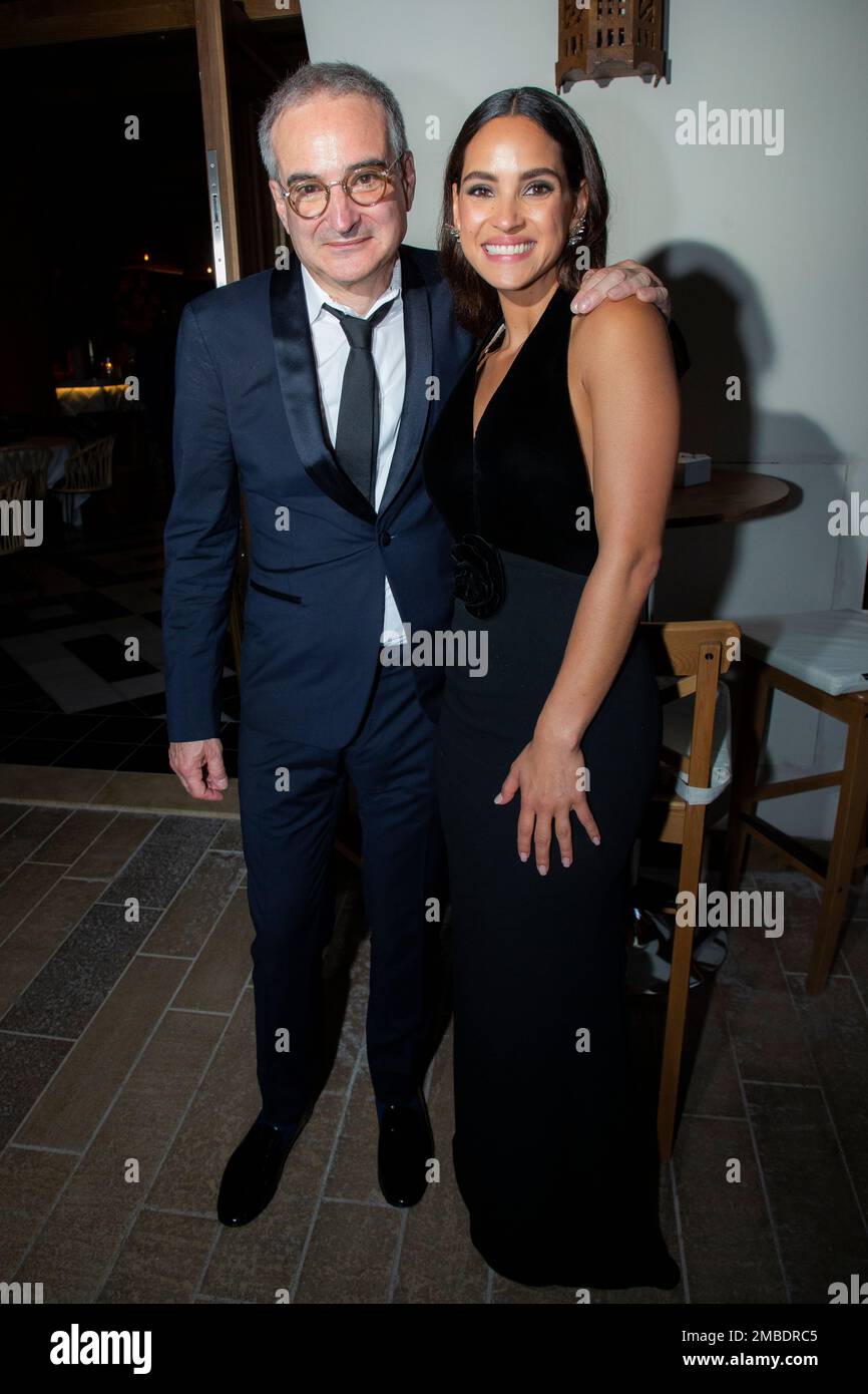 Director Olivier Assayas, left, and Adria Arjona pose for photographs ...
