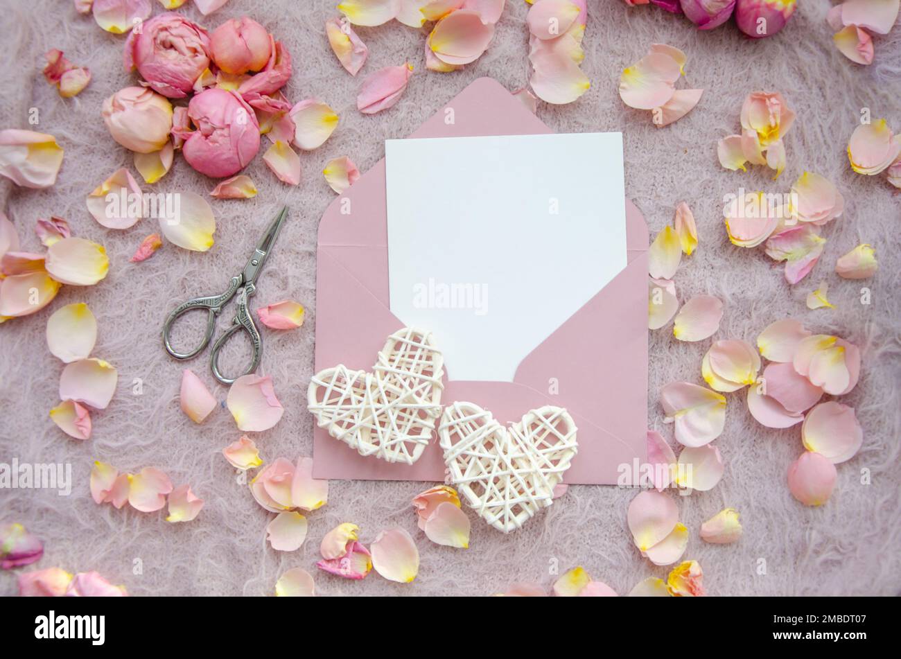 Craft pink envelope with blank card, vintage scissors, decorative ...