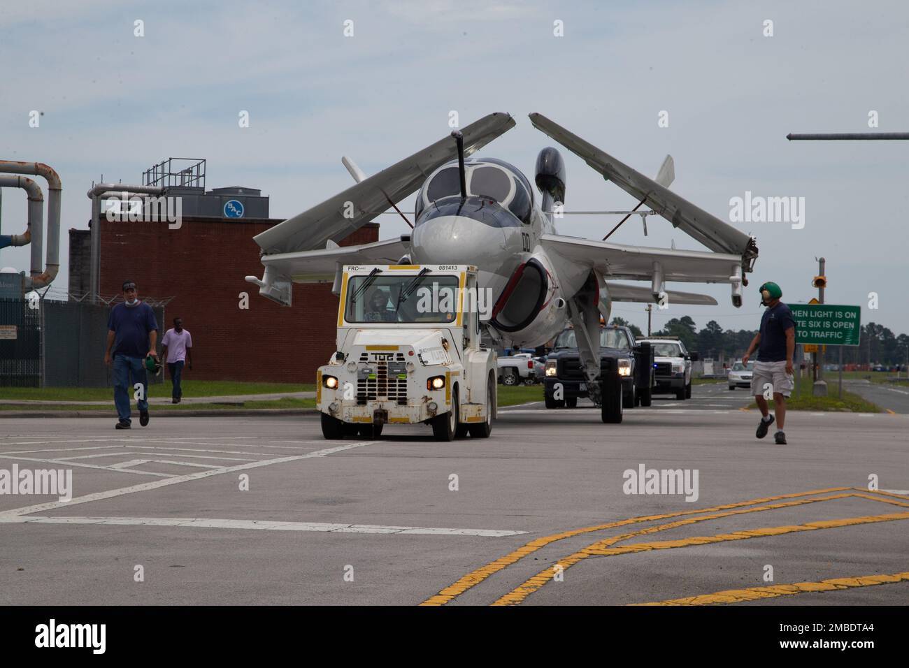 Fleet Readiness Center East contractors escort an EA-6A Intruder being ...