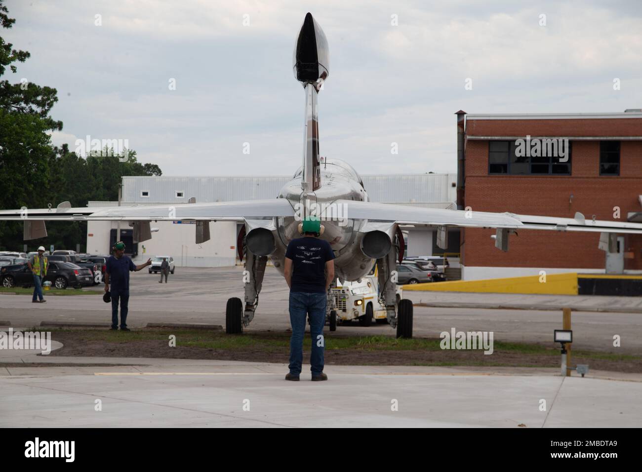Thomas George, a Fleet Readiness Center East contractor, acts as a ...