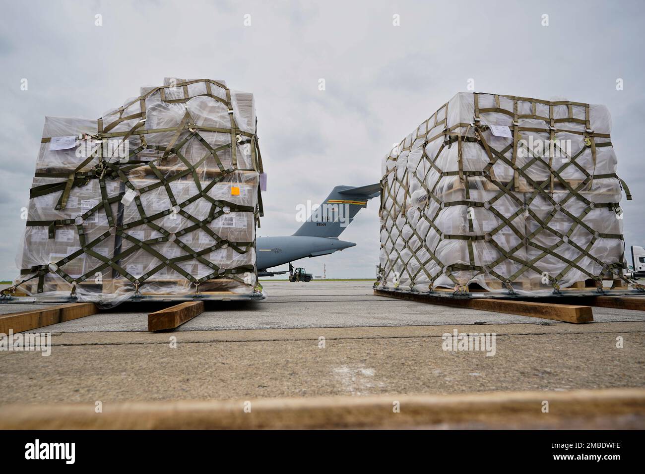 Pallets of baby formula wait to be transferred to a truck after ...