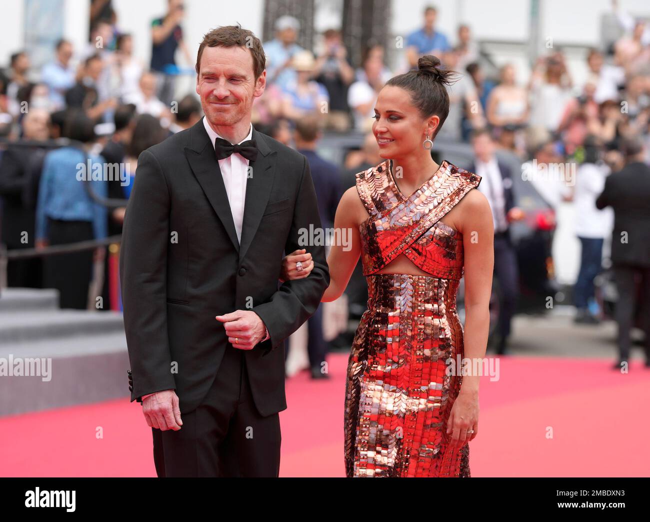 Michael Fassbender, left, and Alicia Vikander pose for photographers ...