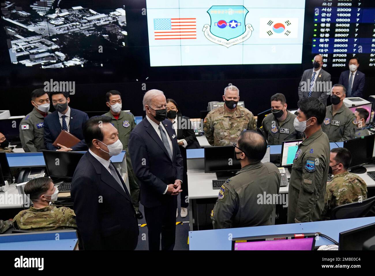 U.S. President Joe Biden, center, with South Korean President Yoon Suk ...