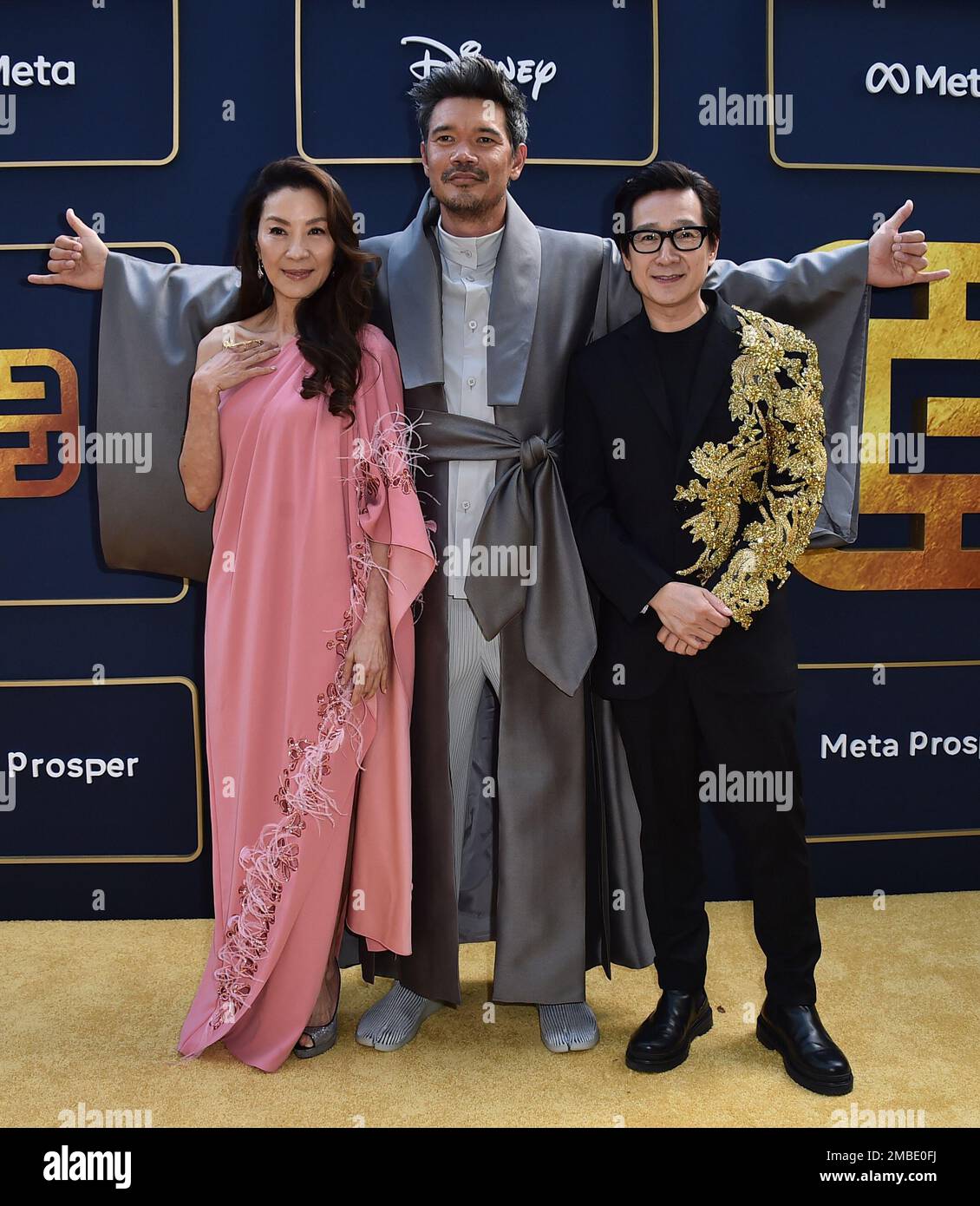 From left, Michelle Yeoh, Destin Daniel Cretton and Ke Huy Quan arrive ...
