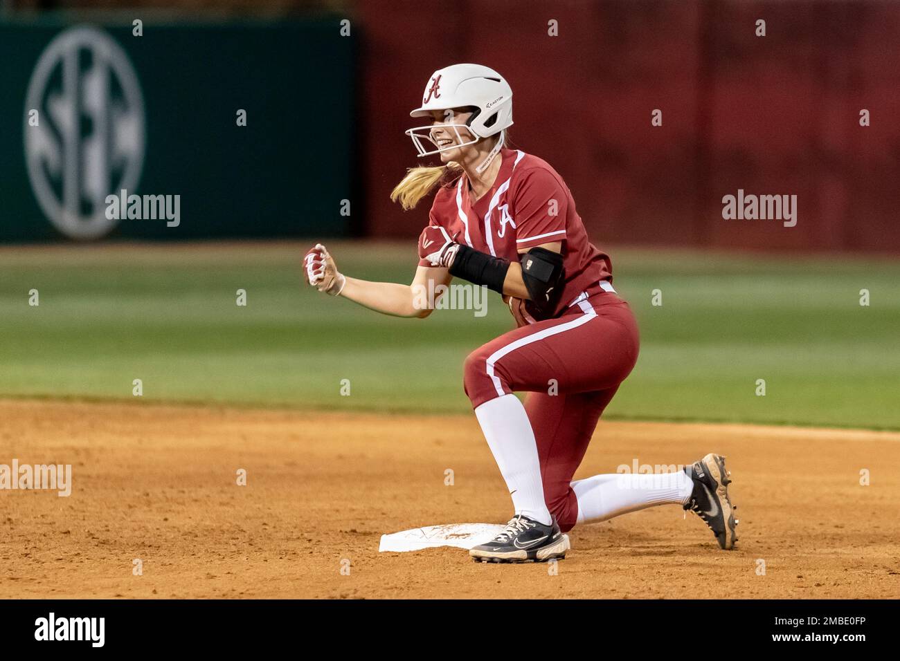Alabama catcher Ally Shipman (34) pumps her fist to celebrate a double ...