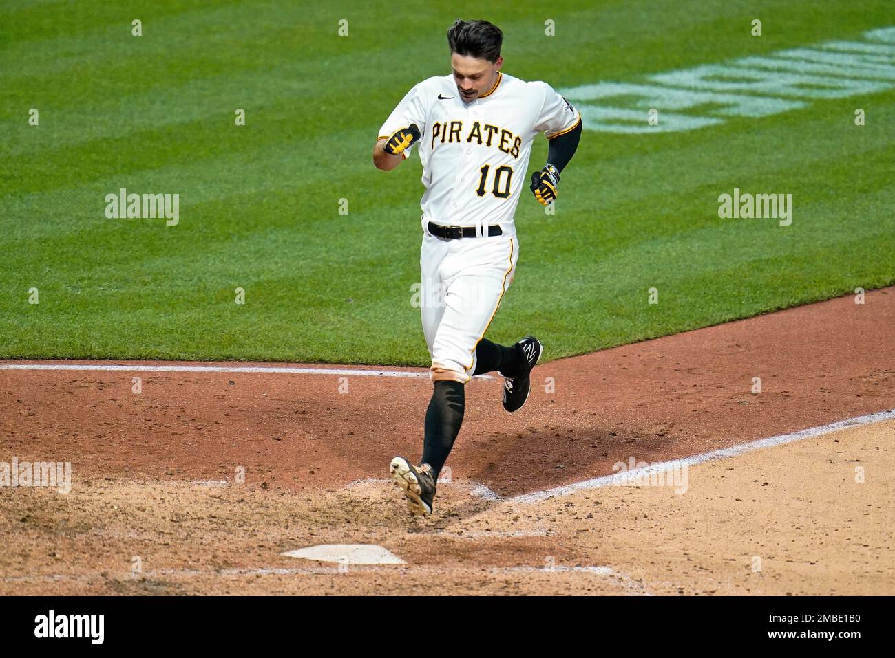 Pittsburgh Pirates' Bryan Reynolds crosses home plate after hitting a ...
