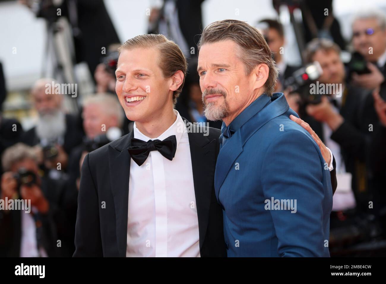 Peter Elkind, left, and Ethan Hawke pose for photographers upon arrival ...
