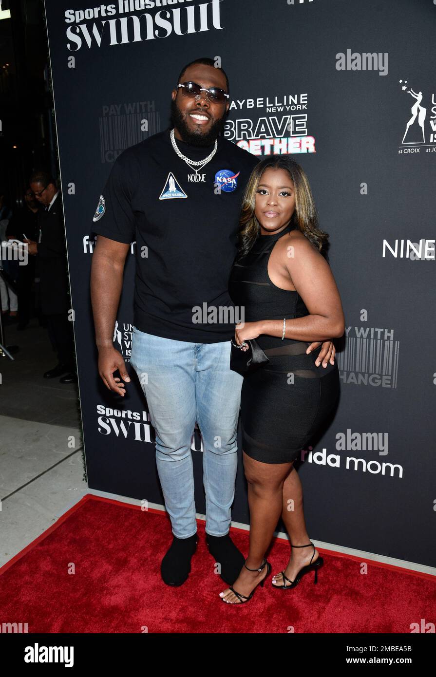 NFL player Andrew Thomas, left, and girlfriend Ashley-Ann Wynter attend ...