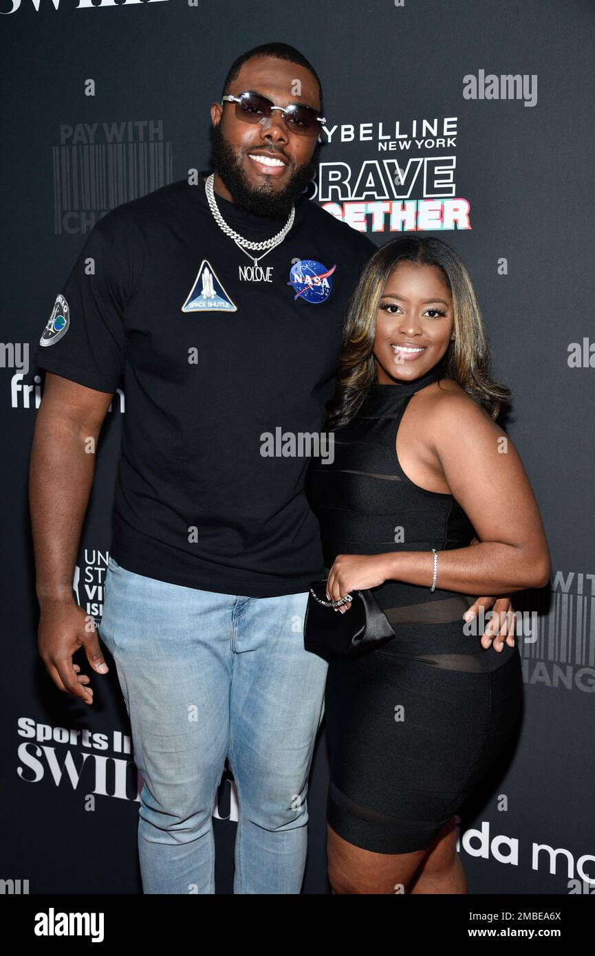 NFL player Andrew Thomas, left, and girlfriend Ashley-Ann Wynter attend ...