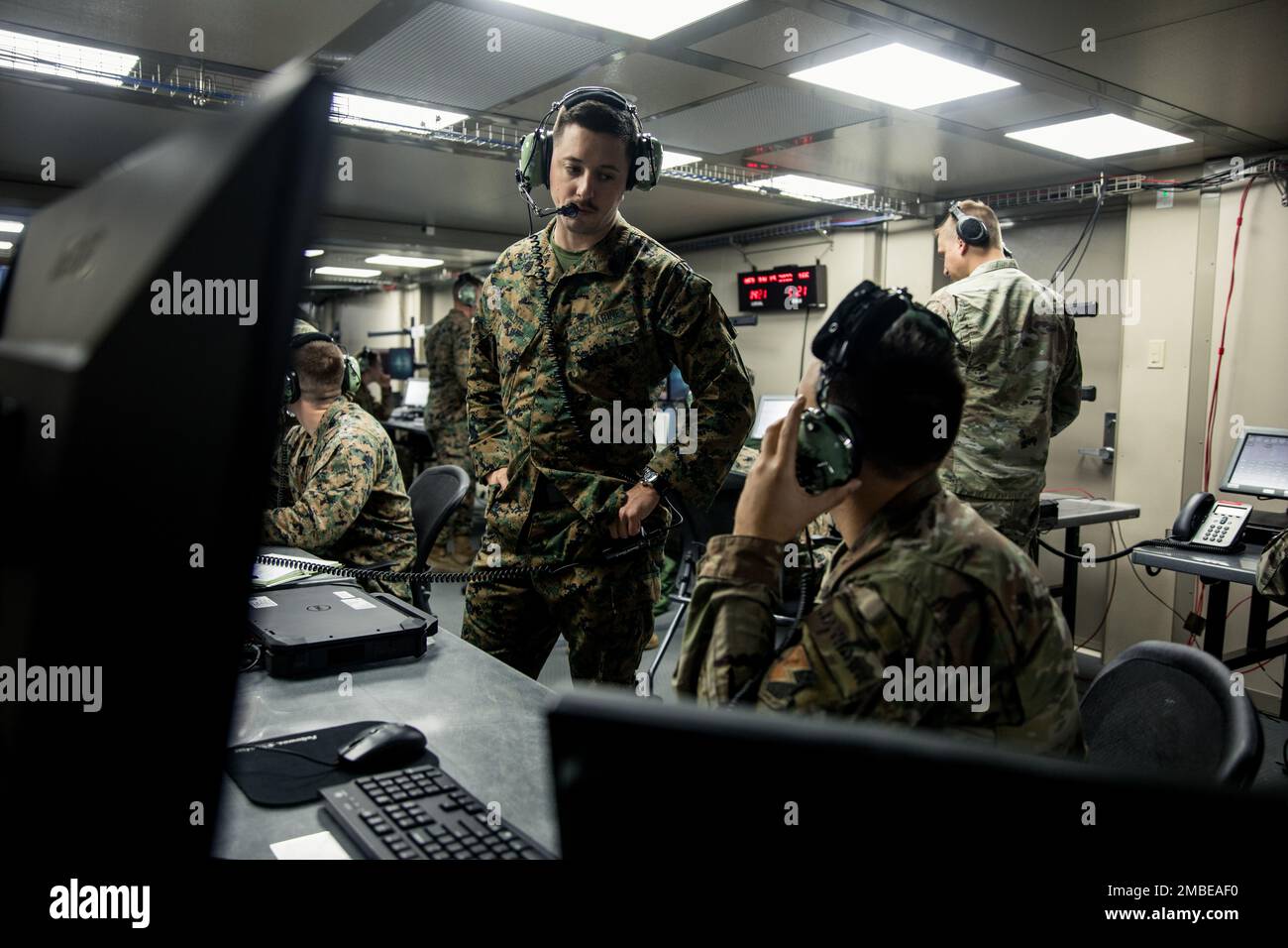 U.S. Marine Corps Staff Sgt. Nathan Belote, left, an early warning and ...