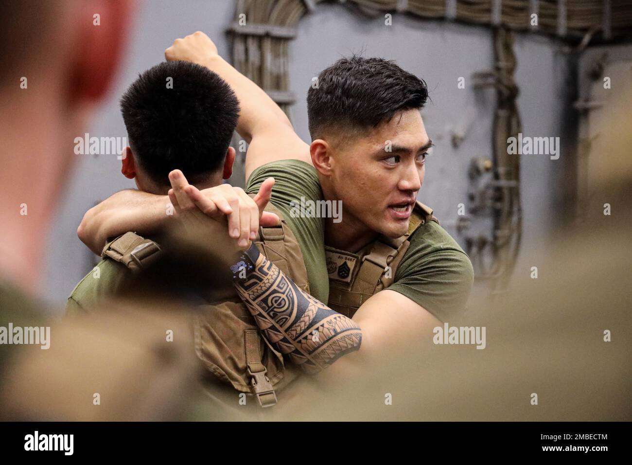 U.S. Marine Corps Staff Sgt. Daniel Lee instructs a Marine Corps ...