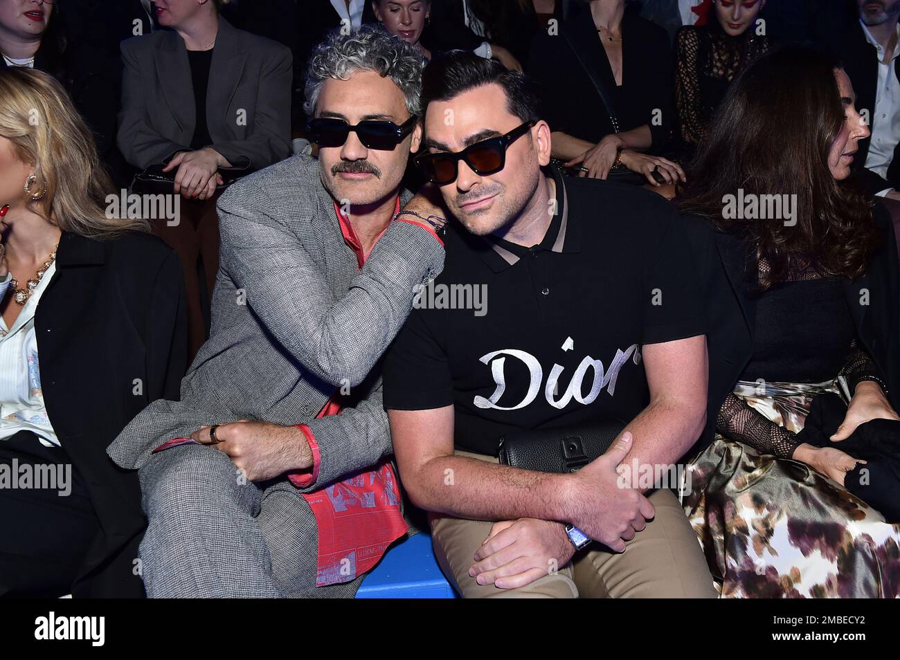 Taika Waititi, left, and Dan Levy attend Dior Men's Spring 2023 ...
