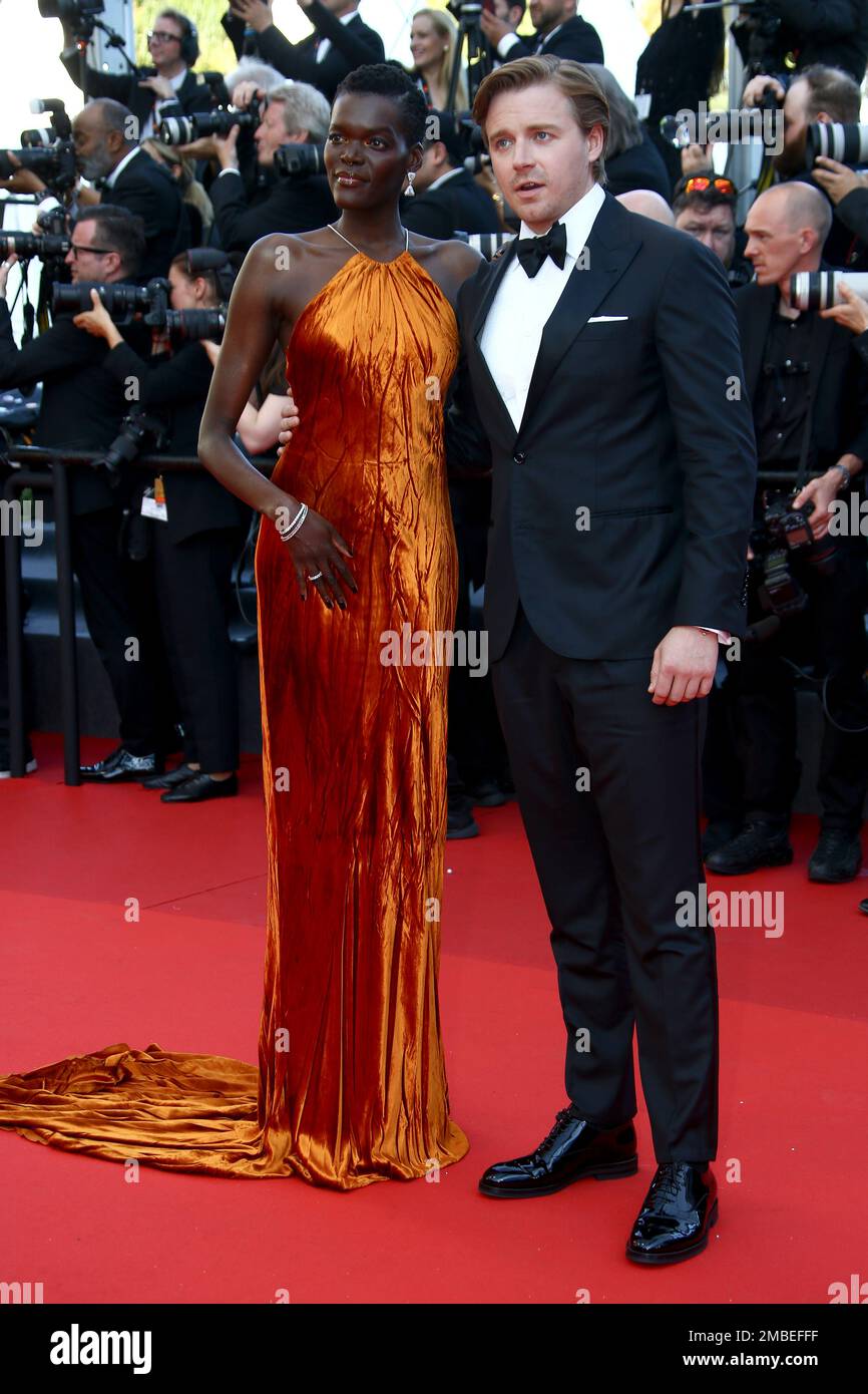 Sheila Atim, left, and Jack Lowden pose for photographers upon arrival ...