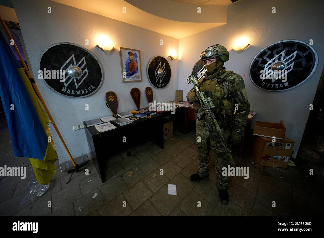 A Russian soldier stands inside the Ukraine's Azov Regiment base ...