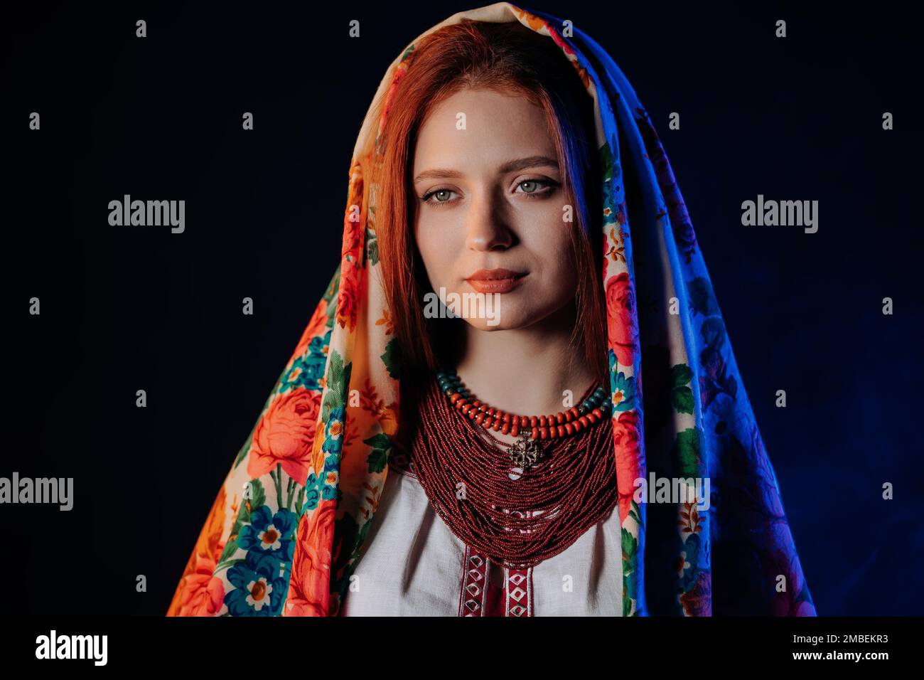 Charming ginger woman in traditional ukrainian handkerchief, necklace ...