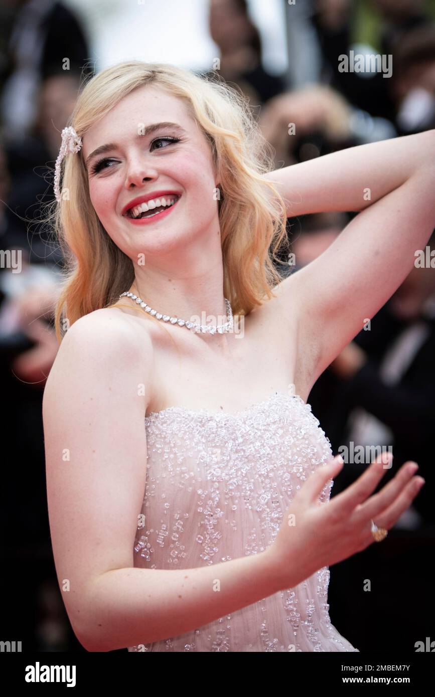 Elle Fanning poses for photographers upon arrival at the premiere of ...