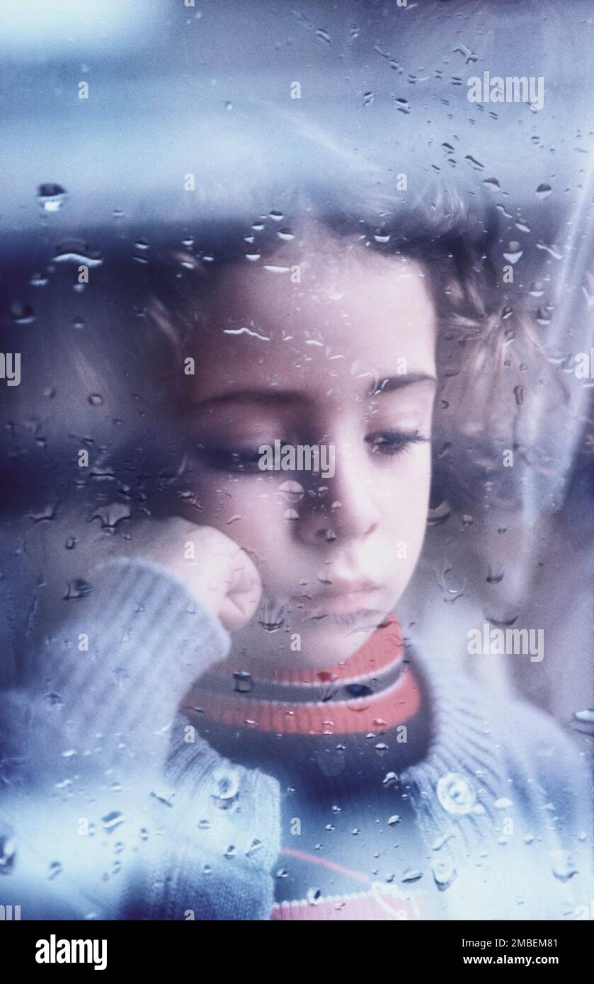 Sad Little Girl In The Rain