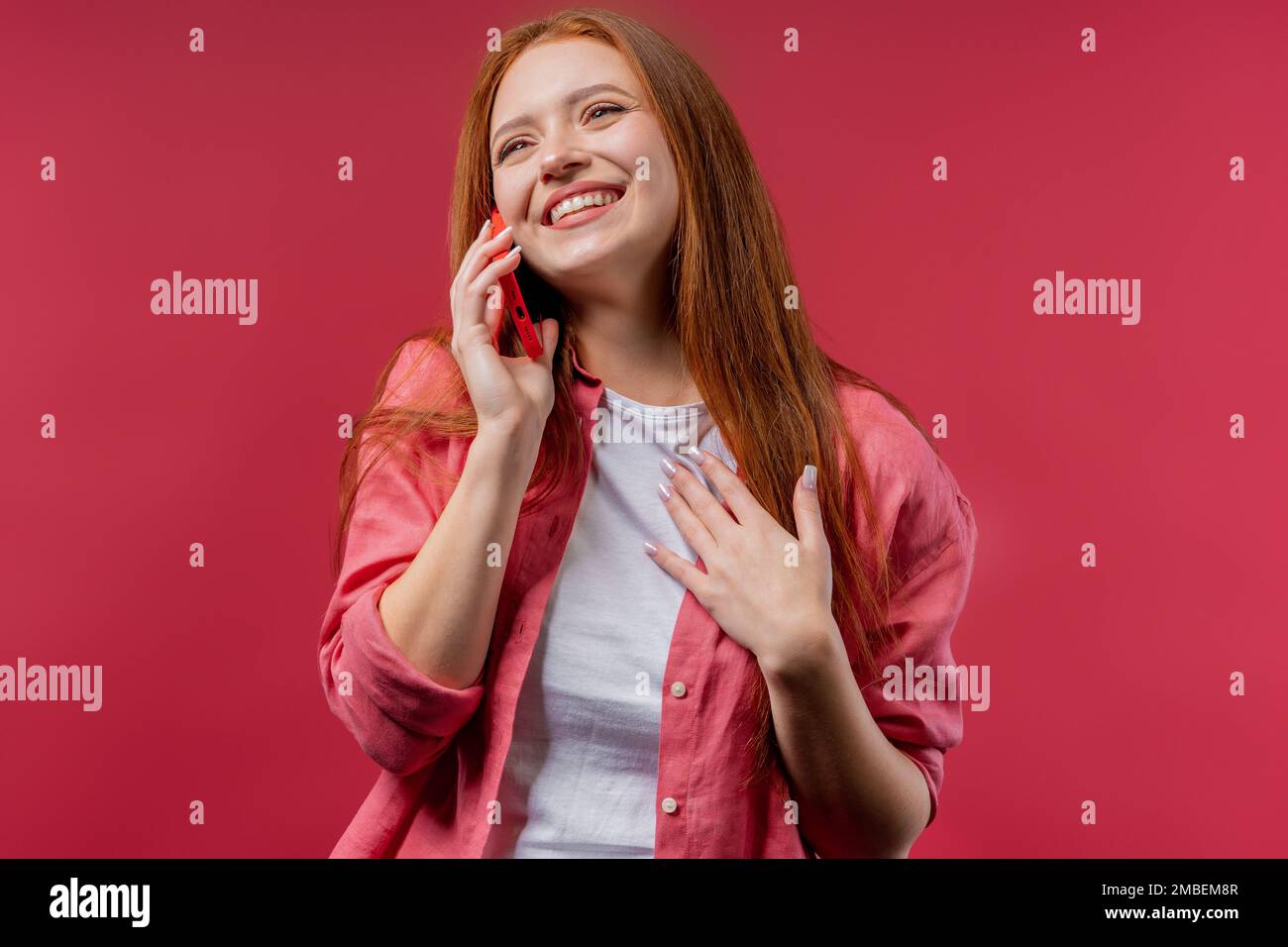 Attractive woman talking by phone, nice joke, smiling. Young lady on ...