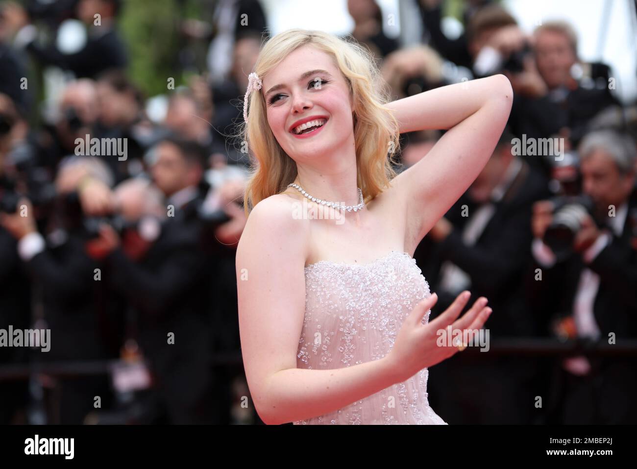 Elle Fanning poses for photographers upon arrival at the premiere of ...