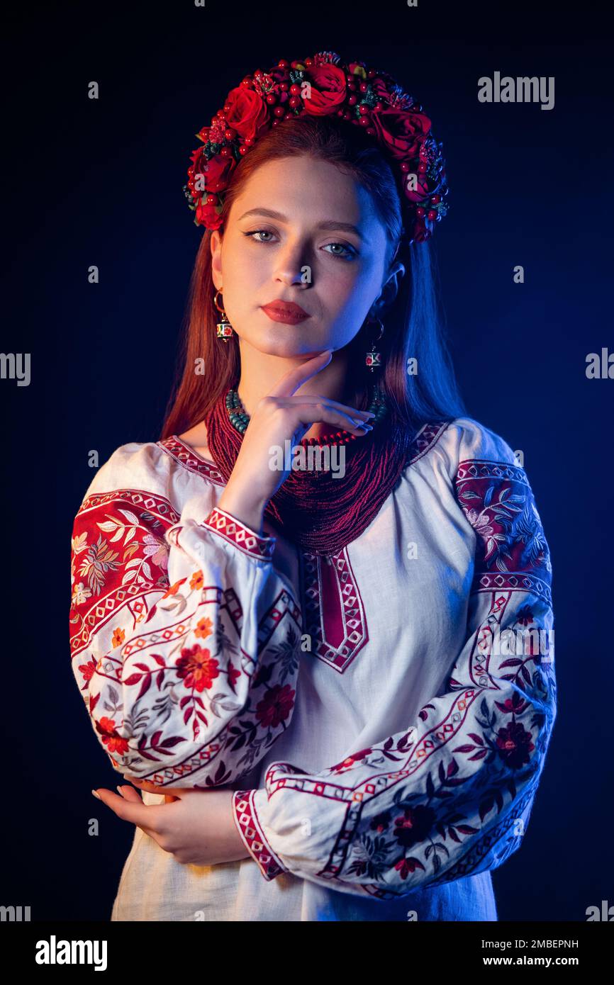 Ukrainian pretty woman in traditional necklaces and embroidered ethnic ...